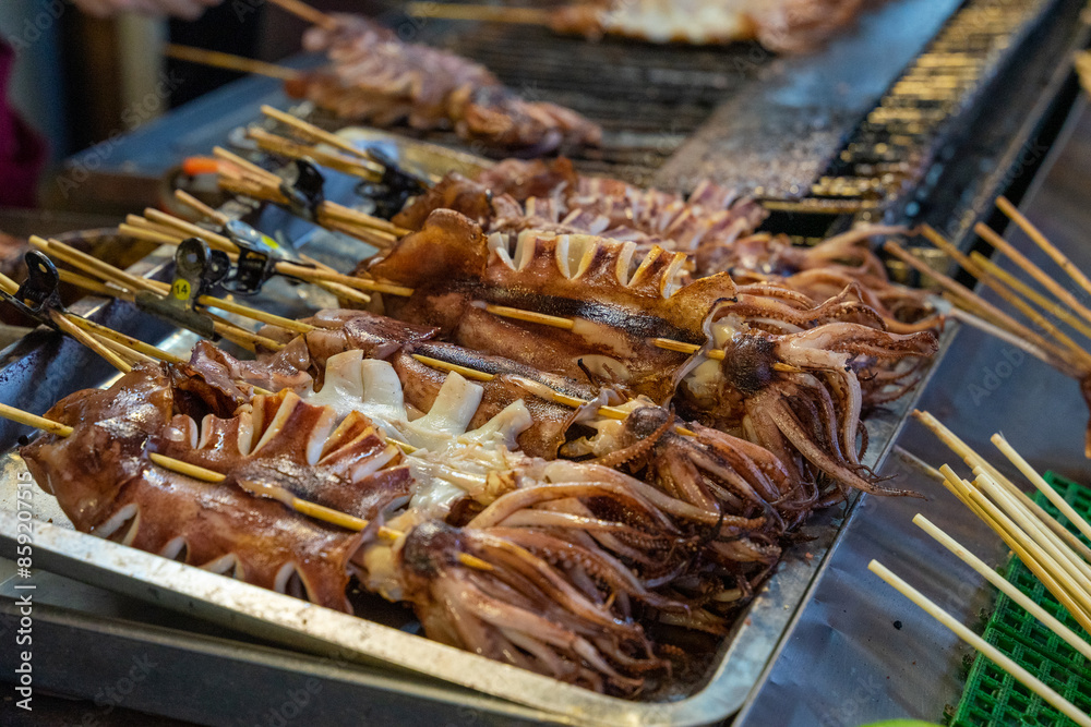 The photo showcases a mouthwatering grilled squid, cooked to perfection ...