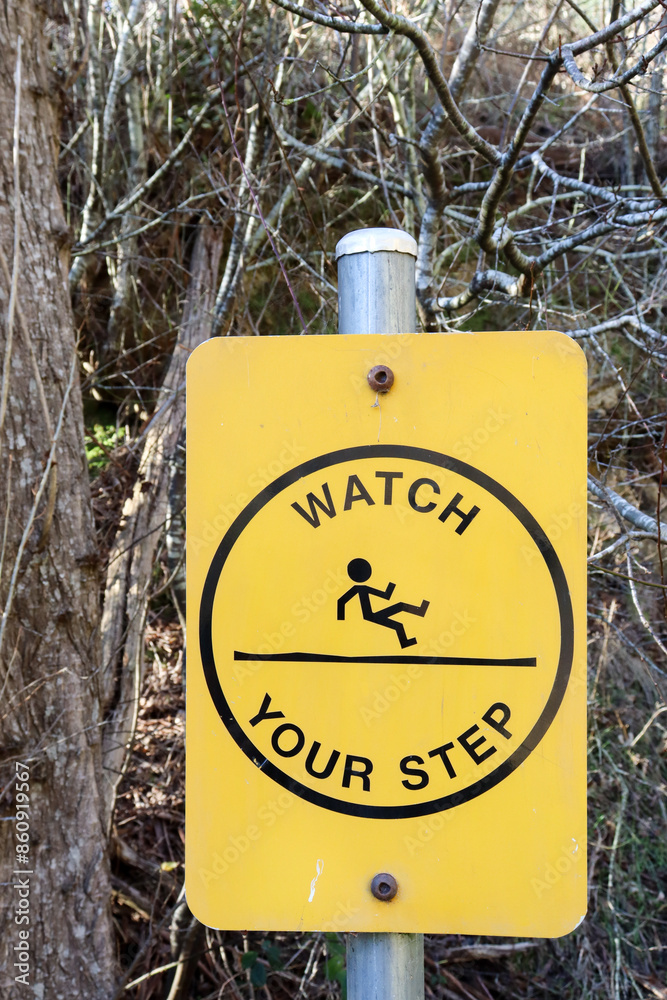 watch your step warning sign on forest path Stock Photo | Adobe Stock