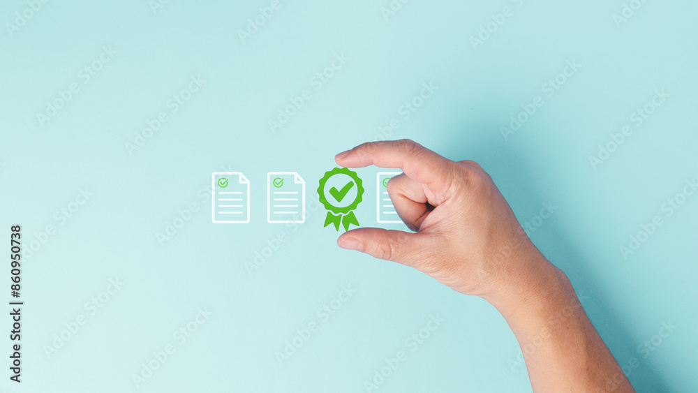 A hand holding green certificate of excellence with check mark icon ...
