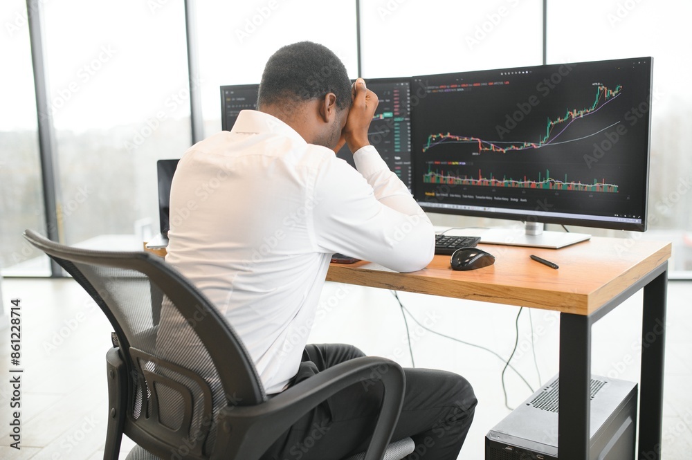Sad African trader has failed in business. Stock Photo | Adobe Stock