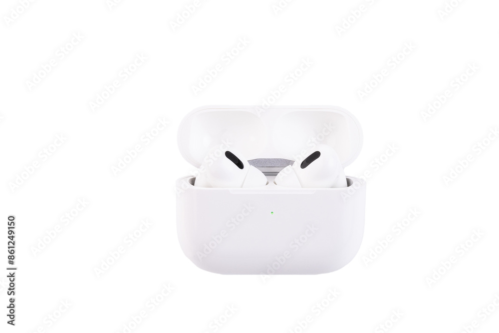 White wireless headphones in a storage and charging box. Transparent ...