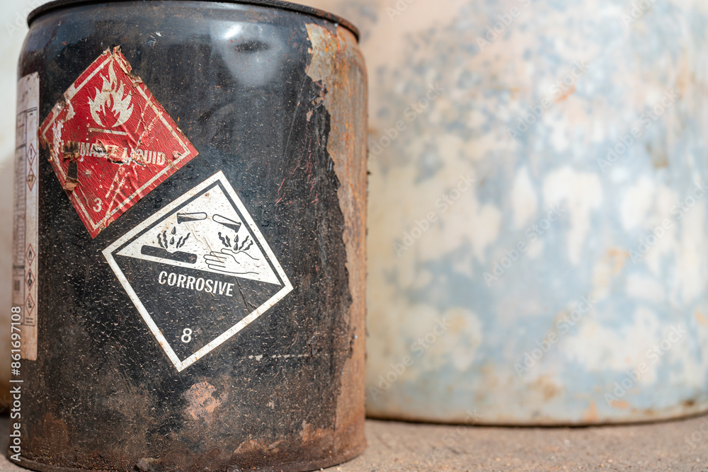 Corrosive and flammable chemical hazardous safety sign on the metal ...