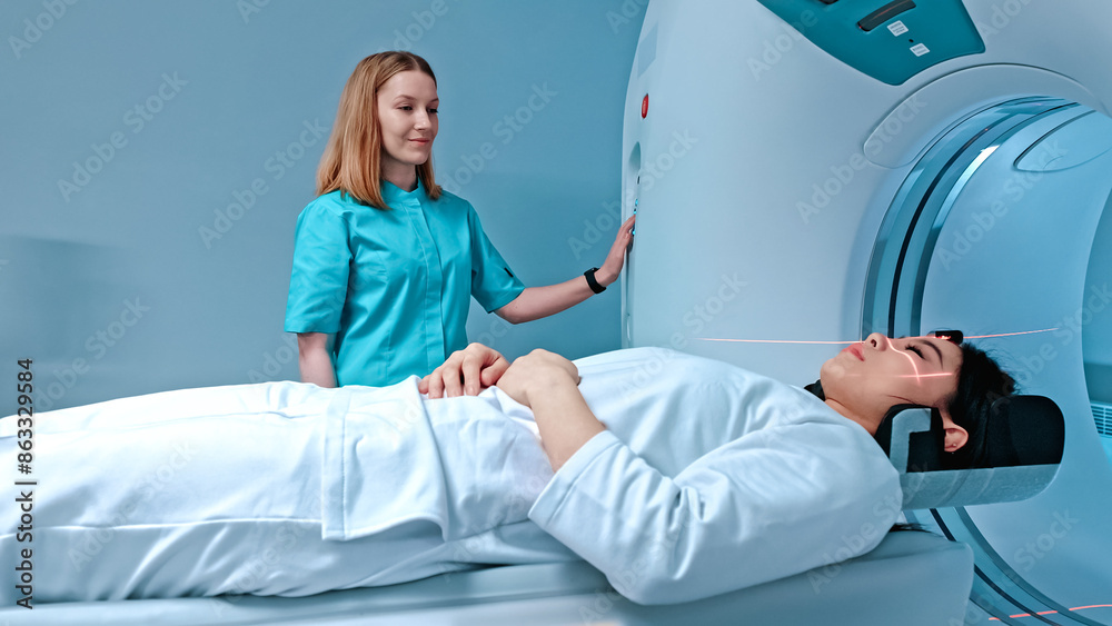 Radiologist with patient in room of computed tomography. Professional ...