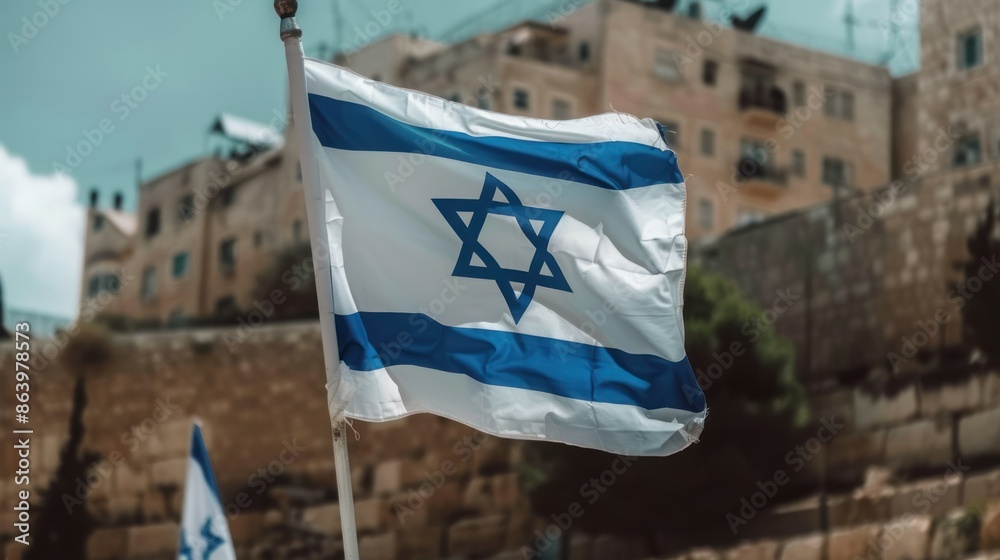Israeli flag waving in front of historic building in Jerusalem ...