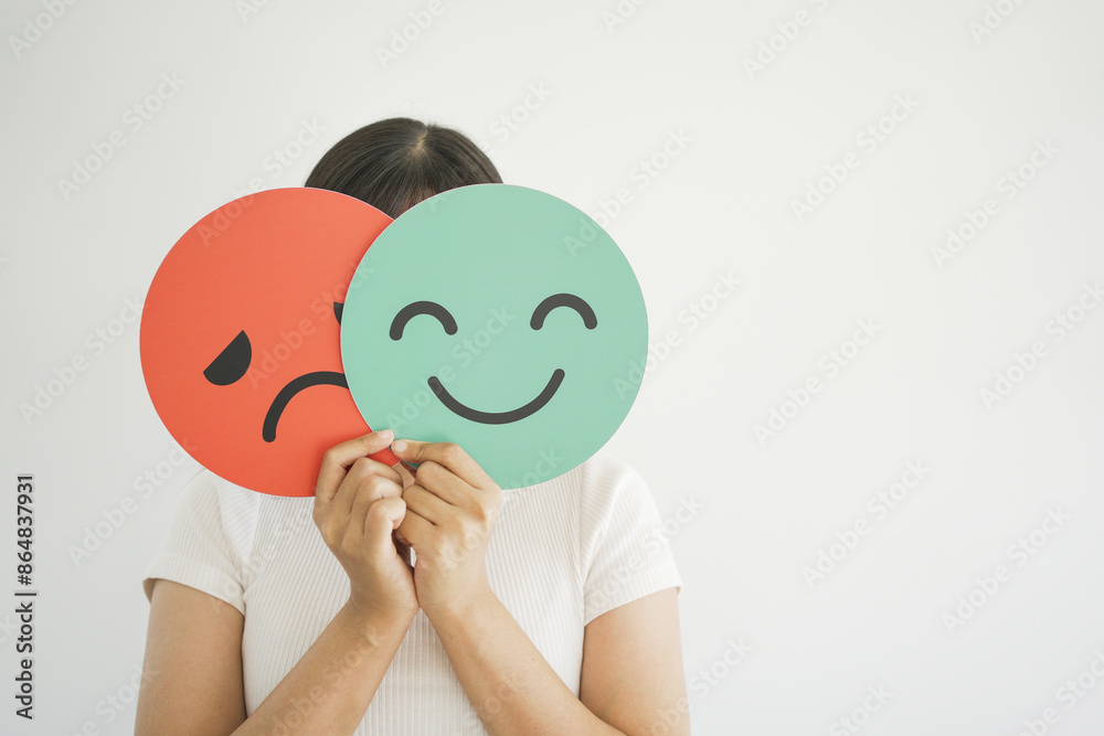 Foto Woman hands holding sad face hiding behind happy face, bipolar and ...