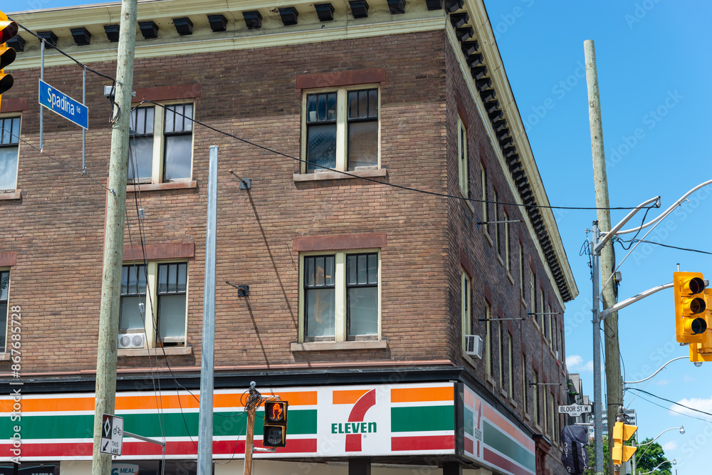 exterior building and sign of 7-Eleven, a convenience store chain ...