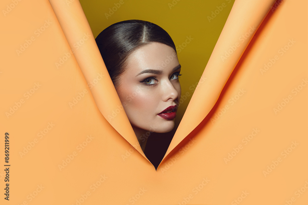 Elegant portrait of a woman with bold makeup, red lips, and intense ...