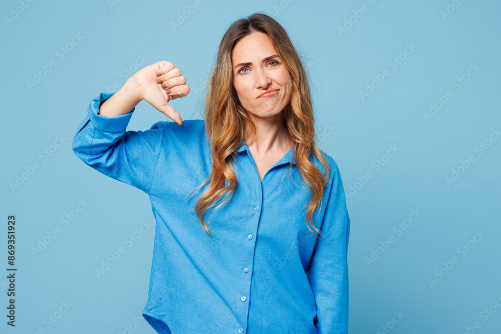 Young sad dissatisfied mad woman she wearing shirt casual clothes ...