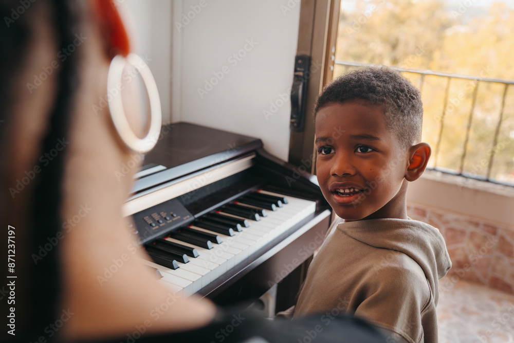 Curious kid learning piano portrait Stock Photo | Adobe Stock