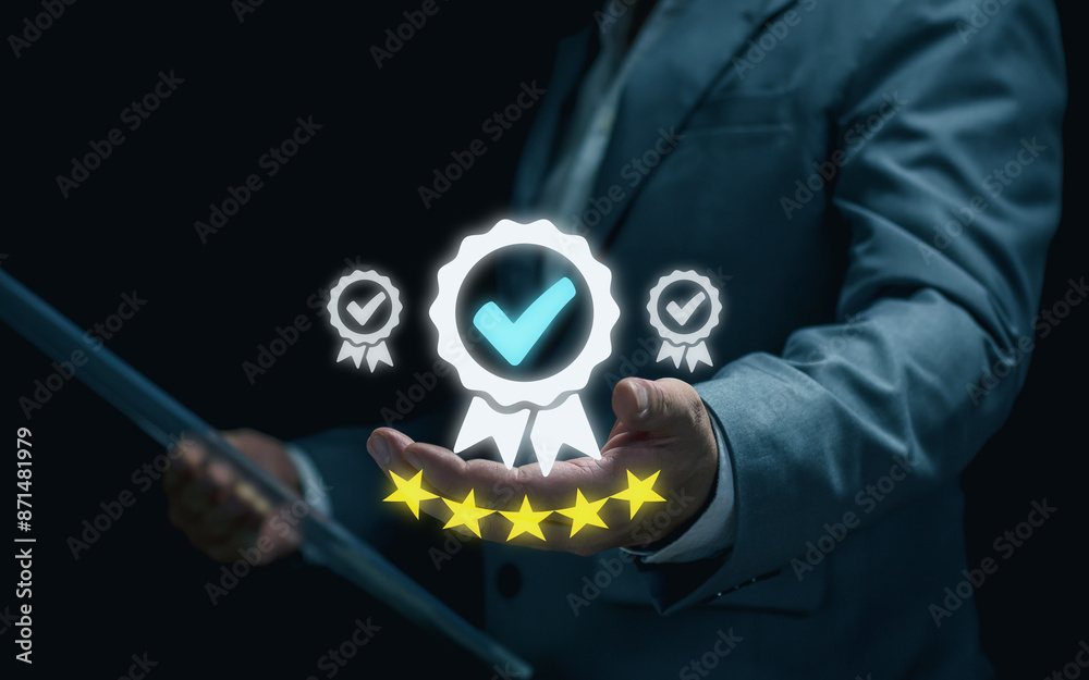 Businessman presenting a hologram of quality certification with a five ...