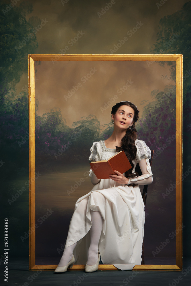 Woman in Regency-era white dress sitting in gold frame, holding open ...