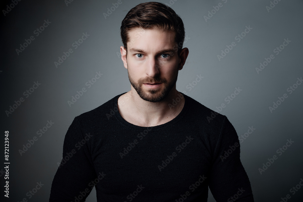 Handsome Young Man in Black Sweater Staring Intently at Camera with an ...