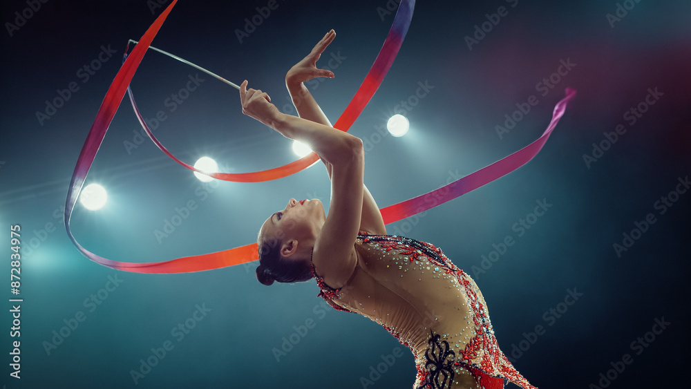 Elegant Female Gymnast in Stunning Backbend, Skillfully Twirling ...