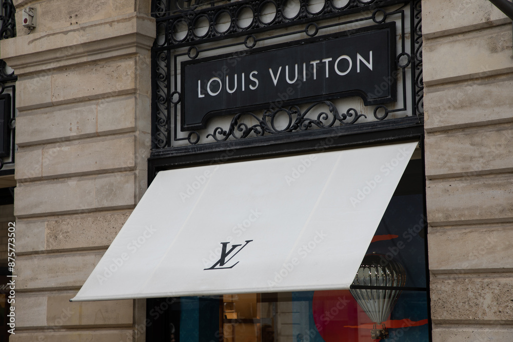 louis vuitton logo brand and sign text chain front wall facade up store ...