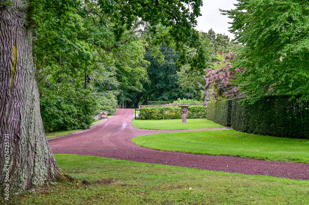 Sofiero Palace Gardens, green park with paths and large trees in ...