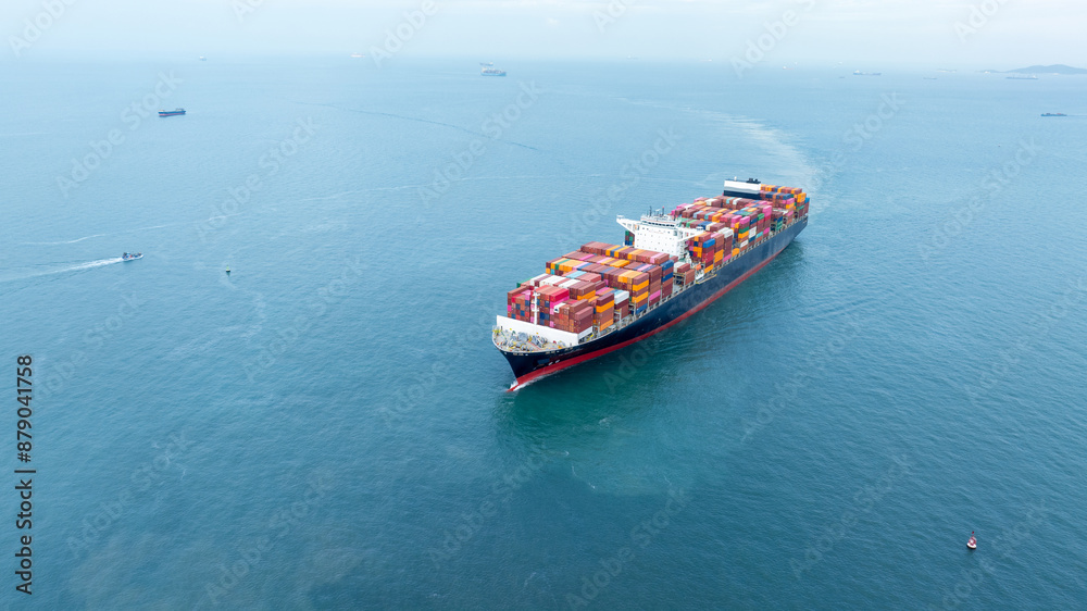Cargo container ship carrying container and running in the ocean near ...