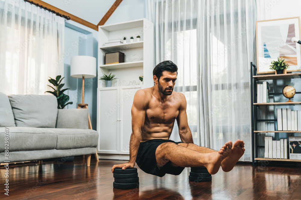 Athletic body and active sporty man lifting himself for effective ...