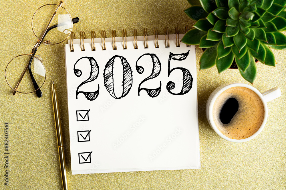 2025 New year resolutions on desk. 2025 goals list with notebook ...