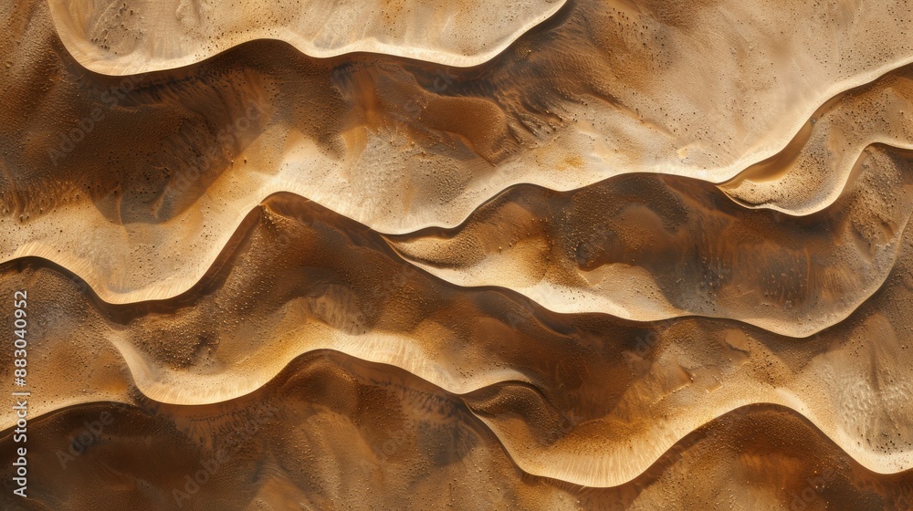 Aerial perspective of a desert landscape featuring intricate sand dune ...