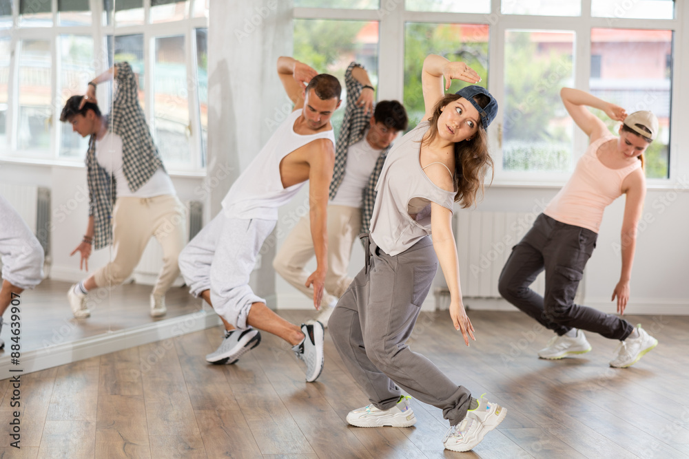 During hip hop dance lesson, girl leads, conducts classes, teaches ...
