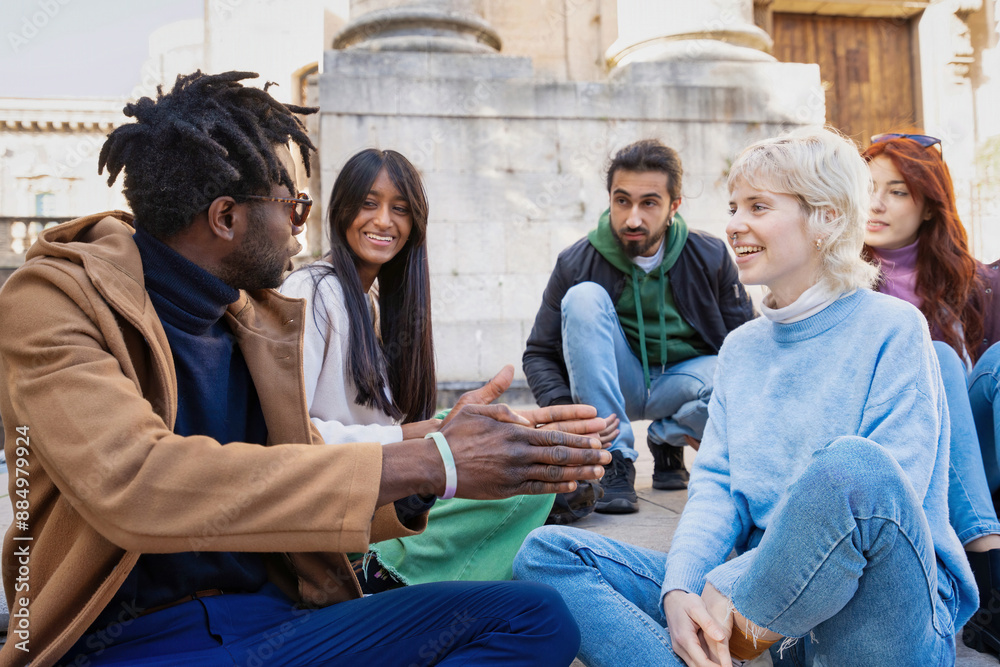 Diverse college students socializing on campus: multicultural ...