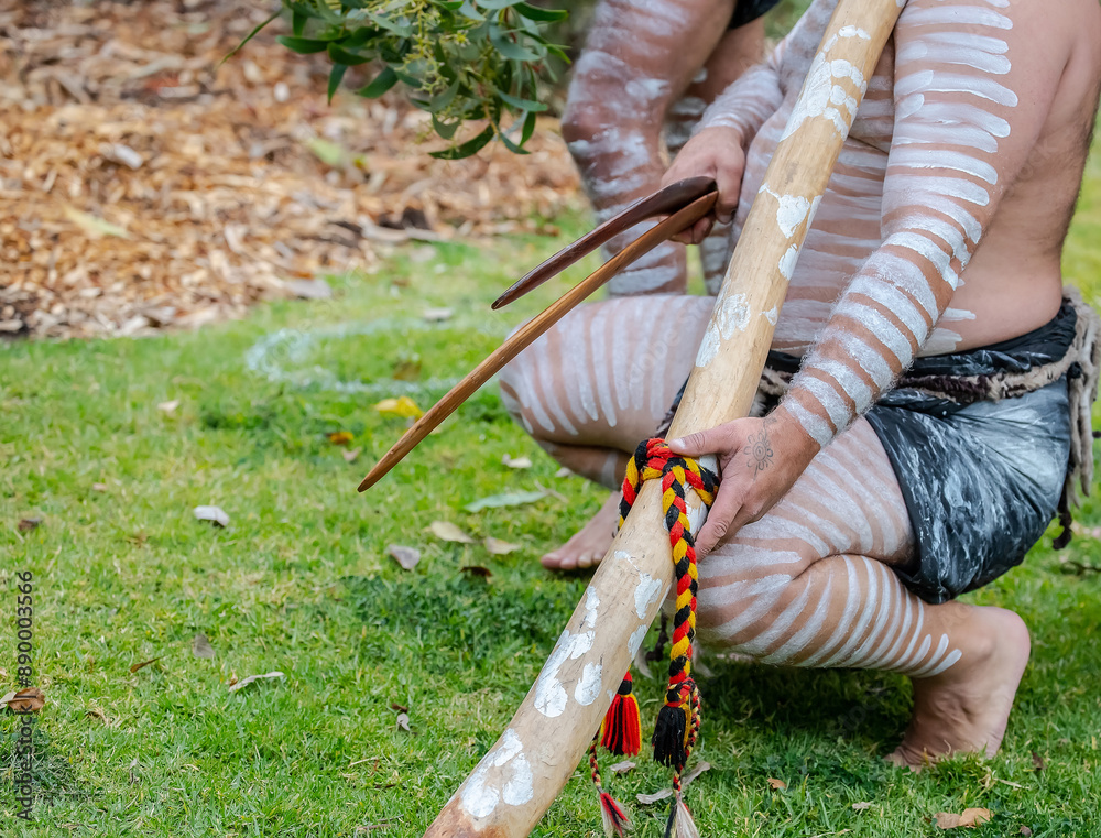 Australian aboriginal ceremony, human hand holds didgeridoo for the ...