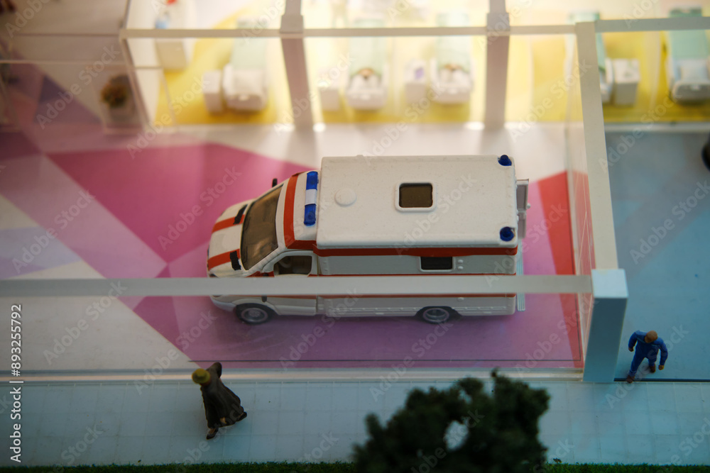 Ambulances outside a hospital entrance in a miniature city scene. Model ...