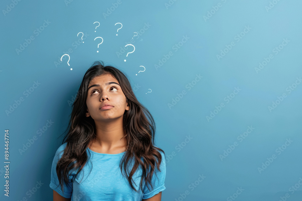 young indian girl thinking with question mark Stock Photo | Adobe Stock