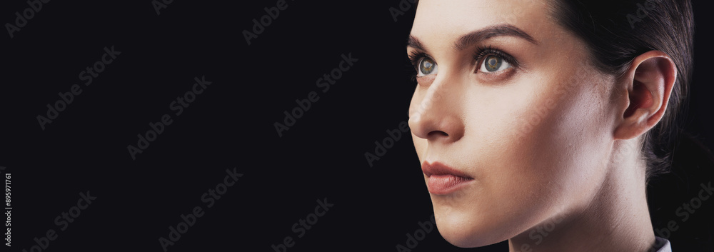 Portrait Of Female Face Staring Aside Over Black Studio Background ...