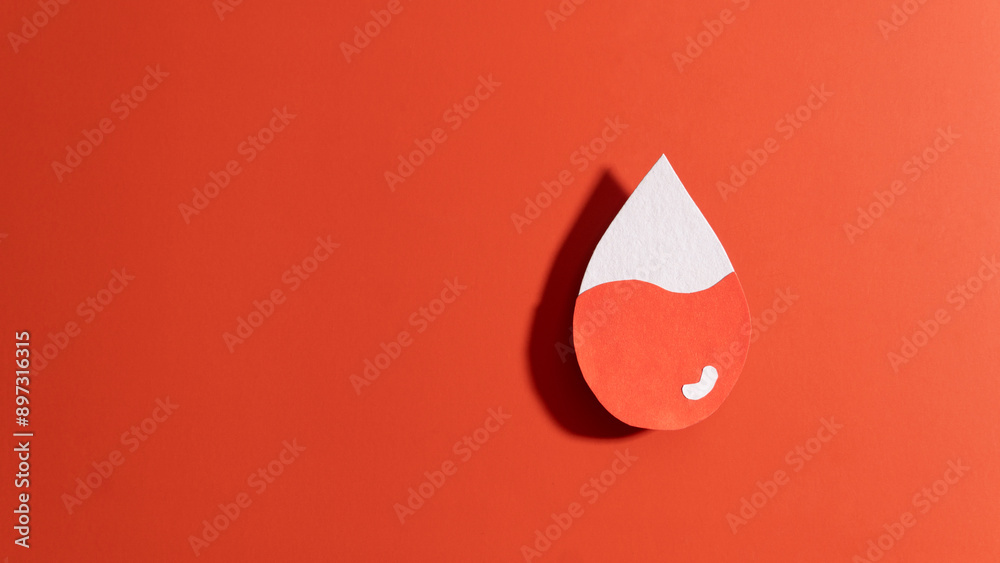Blood drop with low blood level made from paper on red background ...