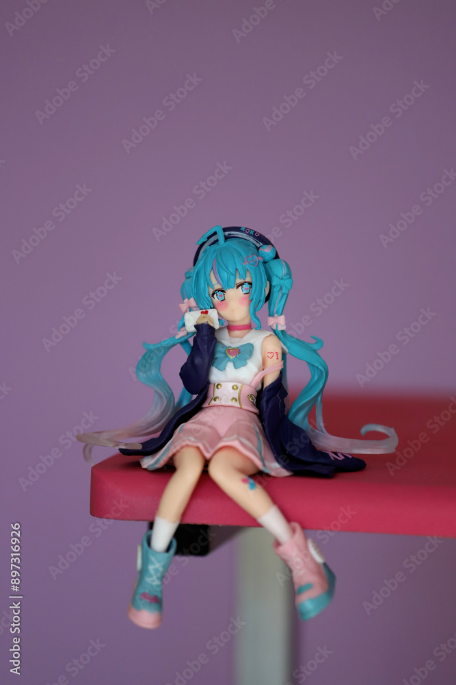 Hatsune Miku figure with violet background with copy space. Virtual ...
