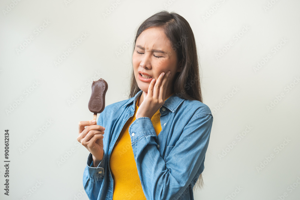 Face expression suffering from sensitive teeth and cold, asian young ...