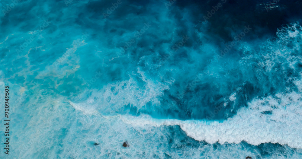 Turquoise ocean sea water white wave splashing deep blue sea. Bird eye ...