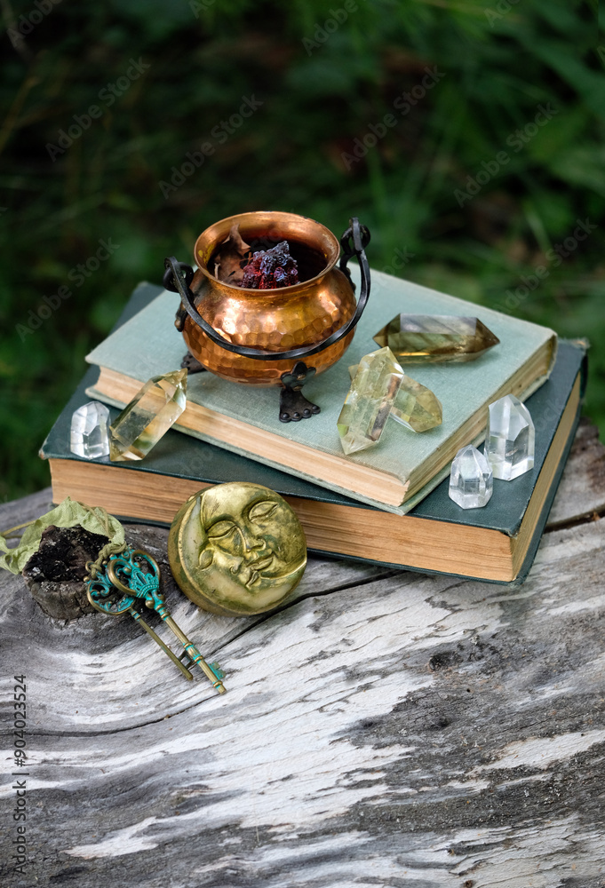 witch cauldron, crystals, symbolic moon amulet, keys, spell books in ...