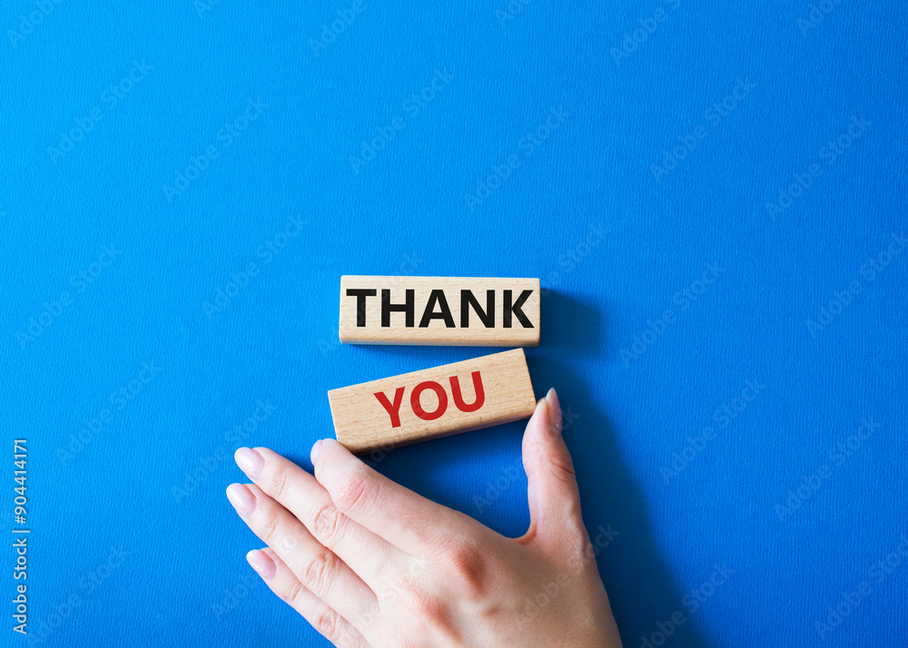 Thank you symbol. Wooden blocks with words Thank you. Businessman hand ...