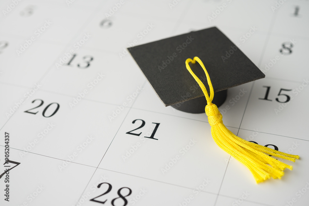 Graduation cap or mortarboard on white blank calendar background ...