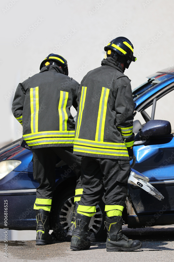 firefighters using powerful hydraulic shears and spreaders open the ...
