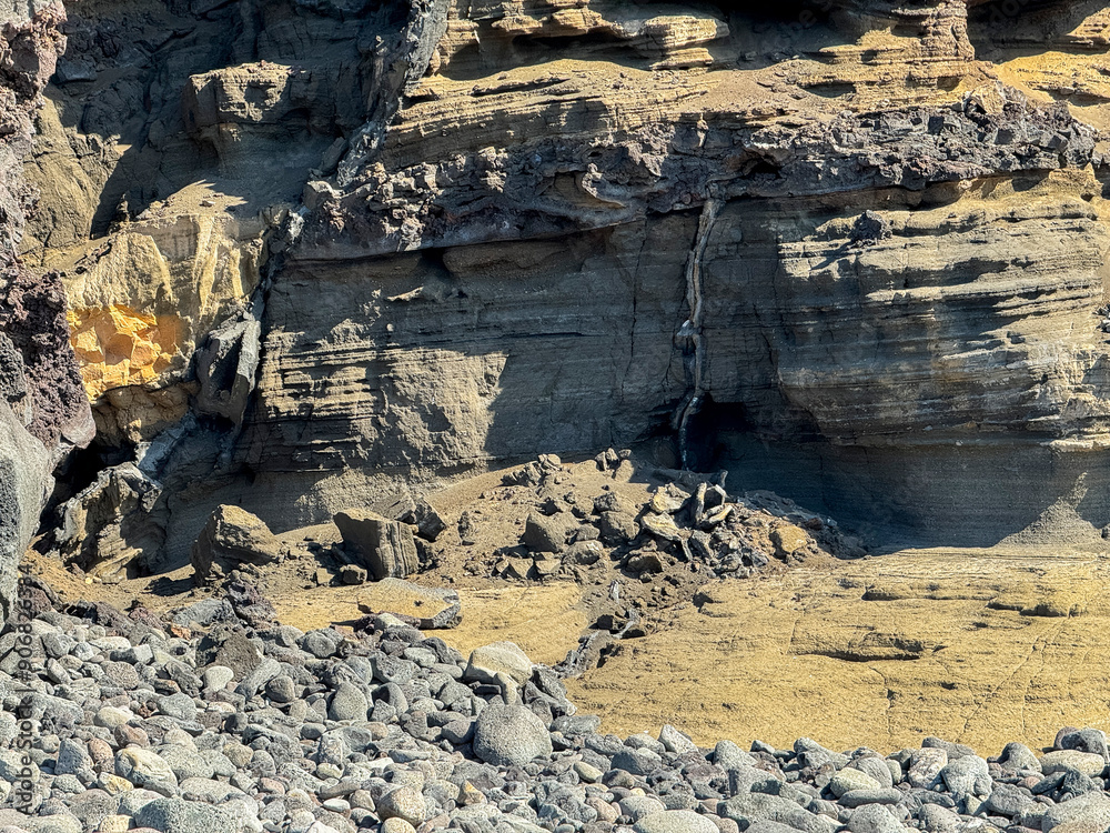 Layers of lava flows and tuff from the dormant volcano on Isla Tortuga ...