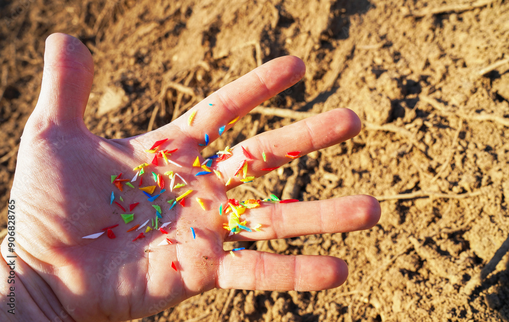 Fotografie Microplastic pollution. Microplastics in ground. Soil ...