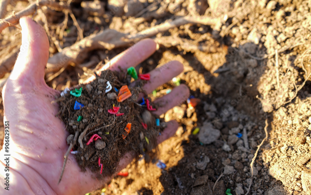 Photo Stock Microplastic pollution. Microplastics in ground. Soil ...
