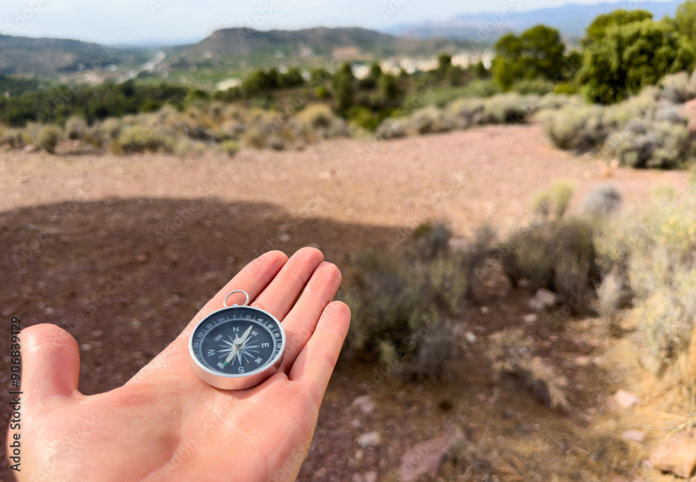 Compass in hand in mountains during Hiking. Tourist compass for ...
