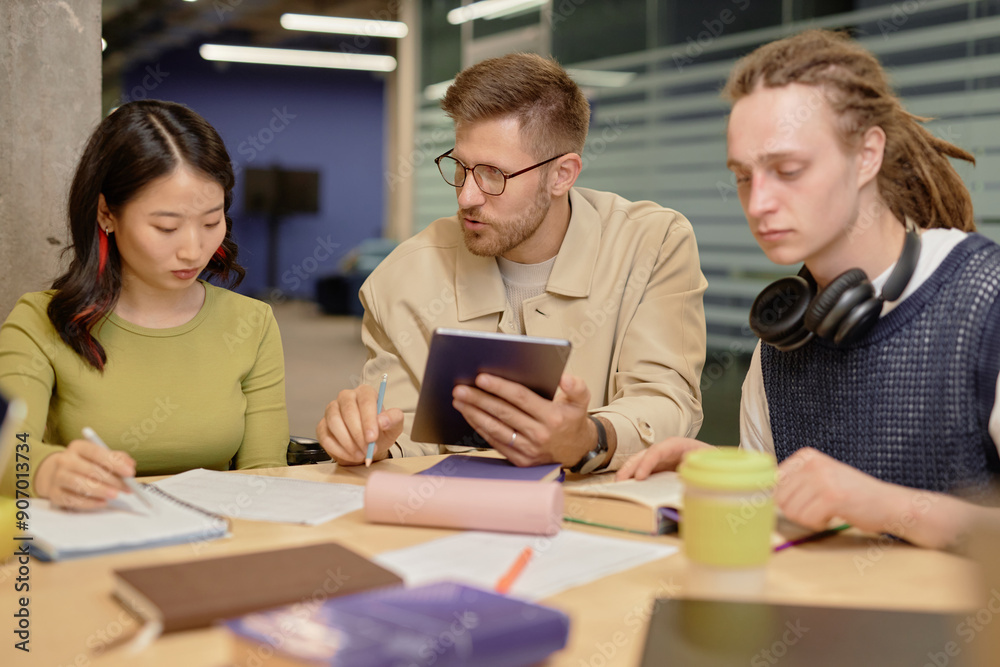 Confident university male professor in glasses explaining written ...