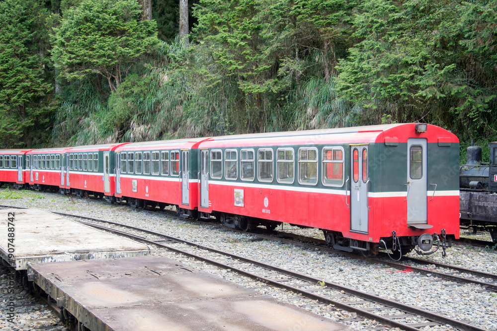 Red train stop at Alishan Station in Alishan National Scenic Area ...