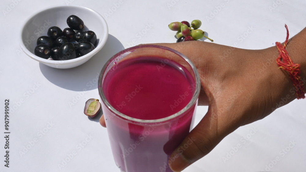 Syzygium cumini fruits juice. Its other names Malabar plum, Java plum ...