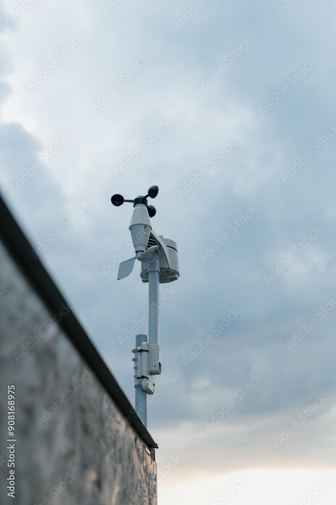 Cup anemometer rotates when the sky is overcast. Wind mast for ...