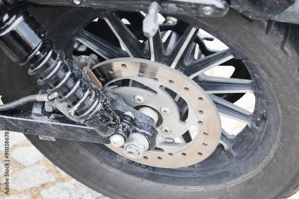 Foto de Stock Motorcycle brake disc close-up. Rubber tire and shock ...