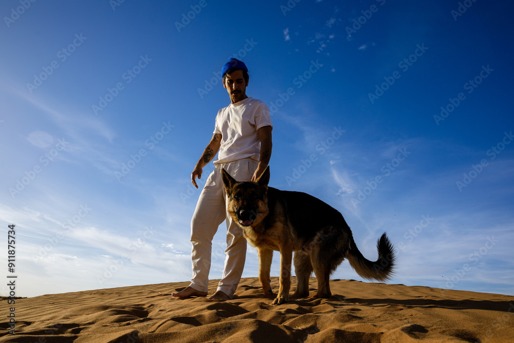 Man Walking German Shepherd Dog in Desert Landscape During Daytime ...