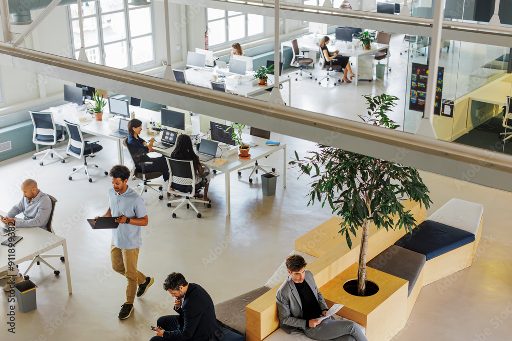 Diverse group of business people working in a modern corporate office ...