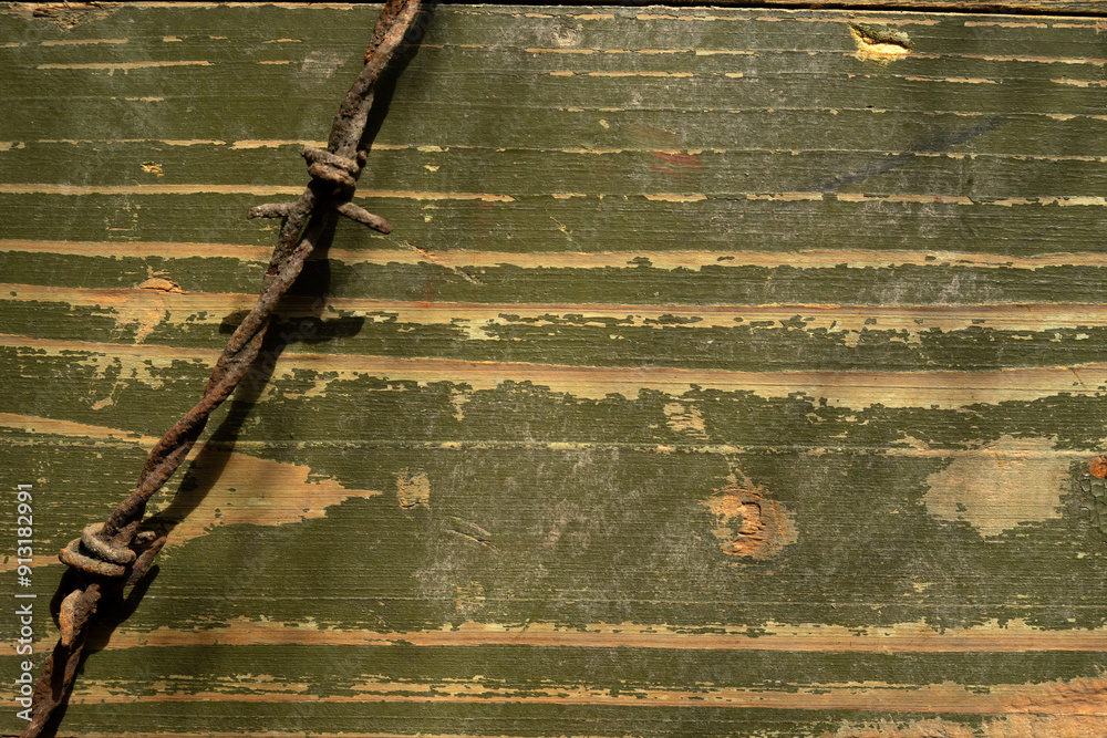 Wooden background from a military box with barbed wire.Military ...