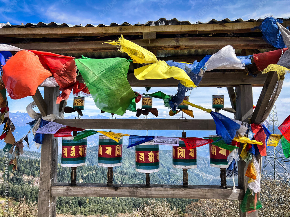 Multi coloured Prayer wheels and prayer flags at Chele La Mountain Pass ...